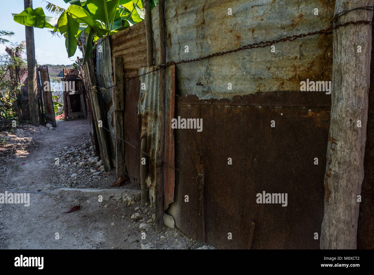 Scrap metal repaired fence on Grandma Island in Santiage de Cuba Stock ...