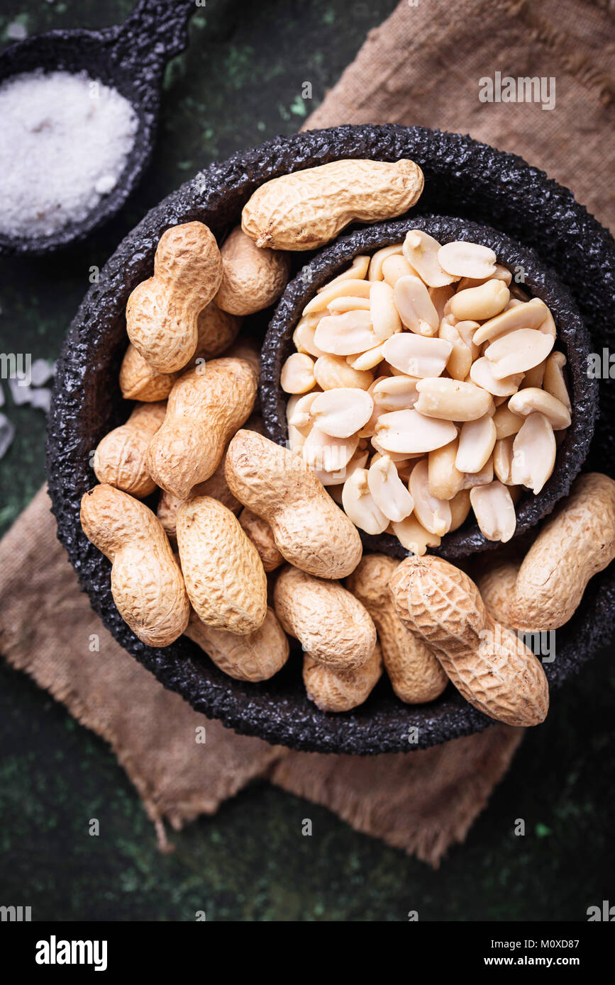 Raw peeled peanuts on bowl. Top view Stock Photo - Alamy