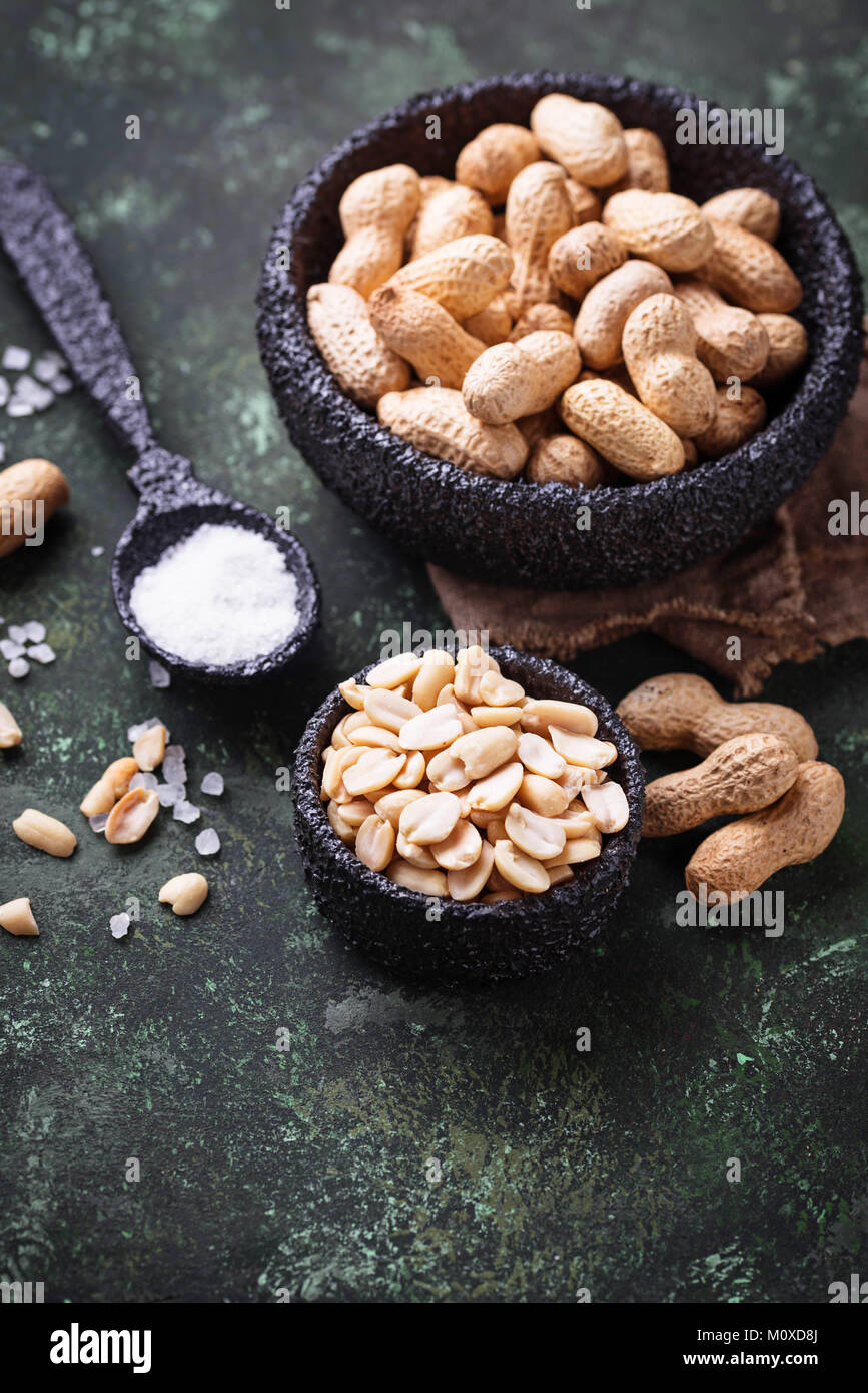 Raw peeled peanuts on bowl. Selective focus Stock Photo - Alamy