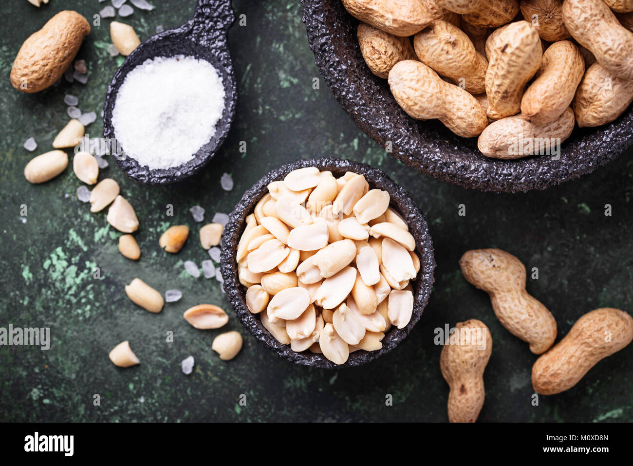 Raw peeled peanuts on bowl. Top view Stock Photo - Alamy