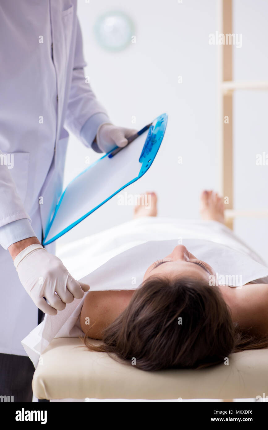 Police coroner examining dead body corpse in morgue Stock Photo - Alamy