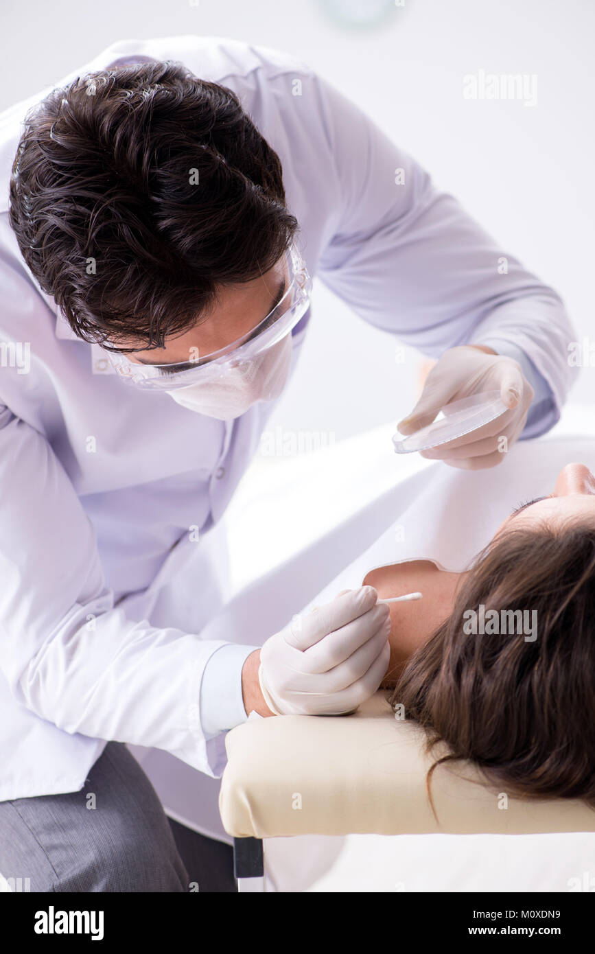 Police coroner examining dead body corpse in morgue Stock Photo - Alamy
