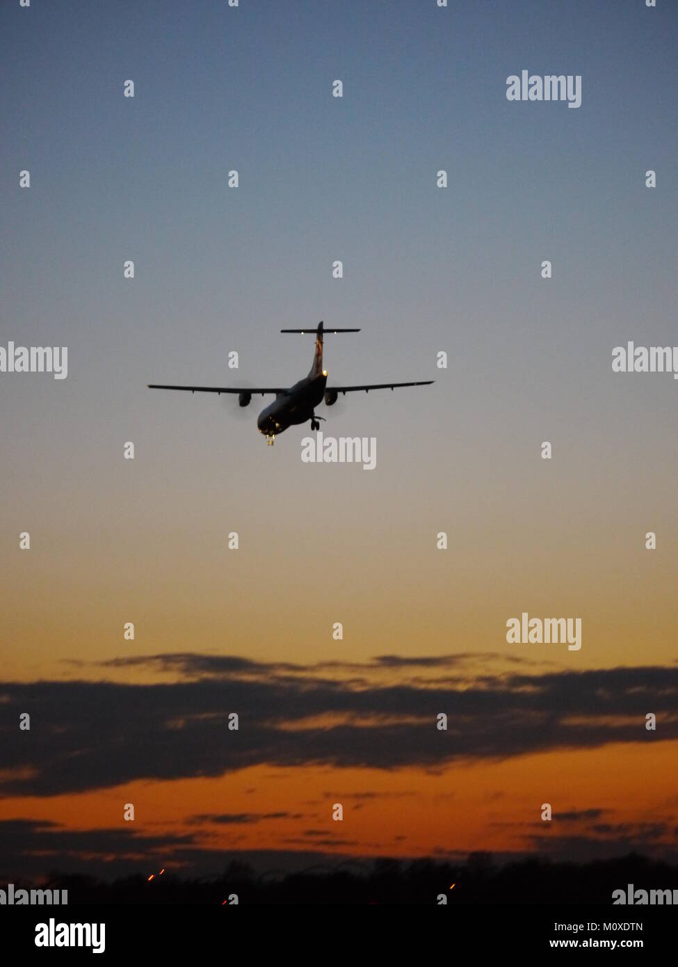 airplane is flying in the sky Stock Photo - Alamy