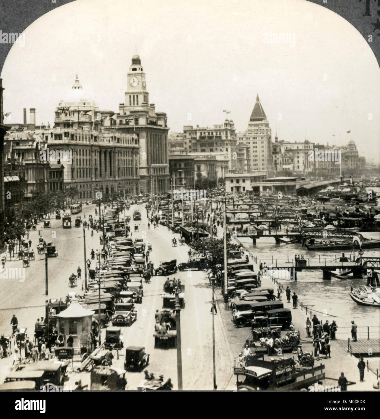 Traffic and boats along the Bund, Shanghai, China, c.1920 Stock Photo ...