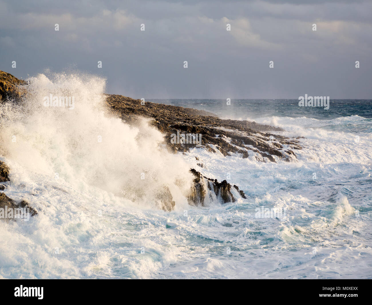 sea with big waves crashing on the rocks after storm Stock Photo - Alamy