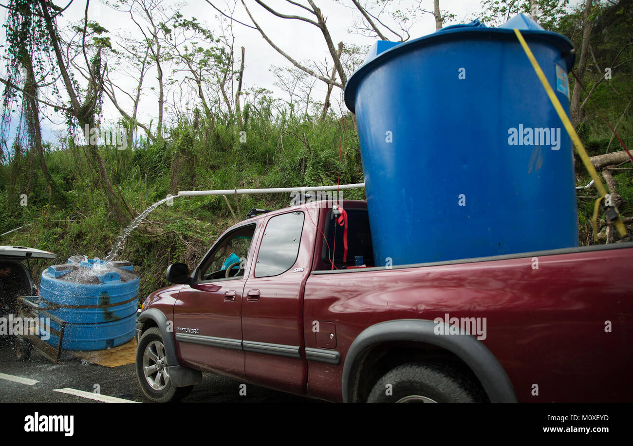 Utuado, Puerto Rico, October 15, 2017 - Survivors fill their water ...