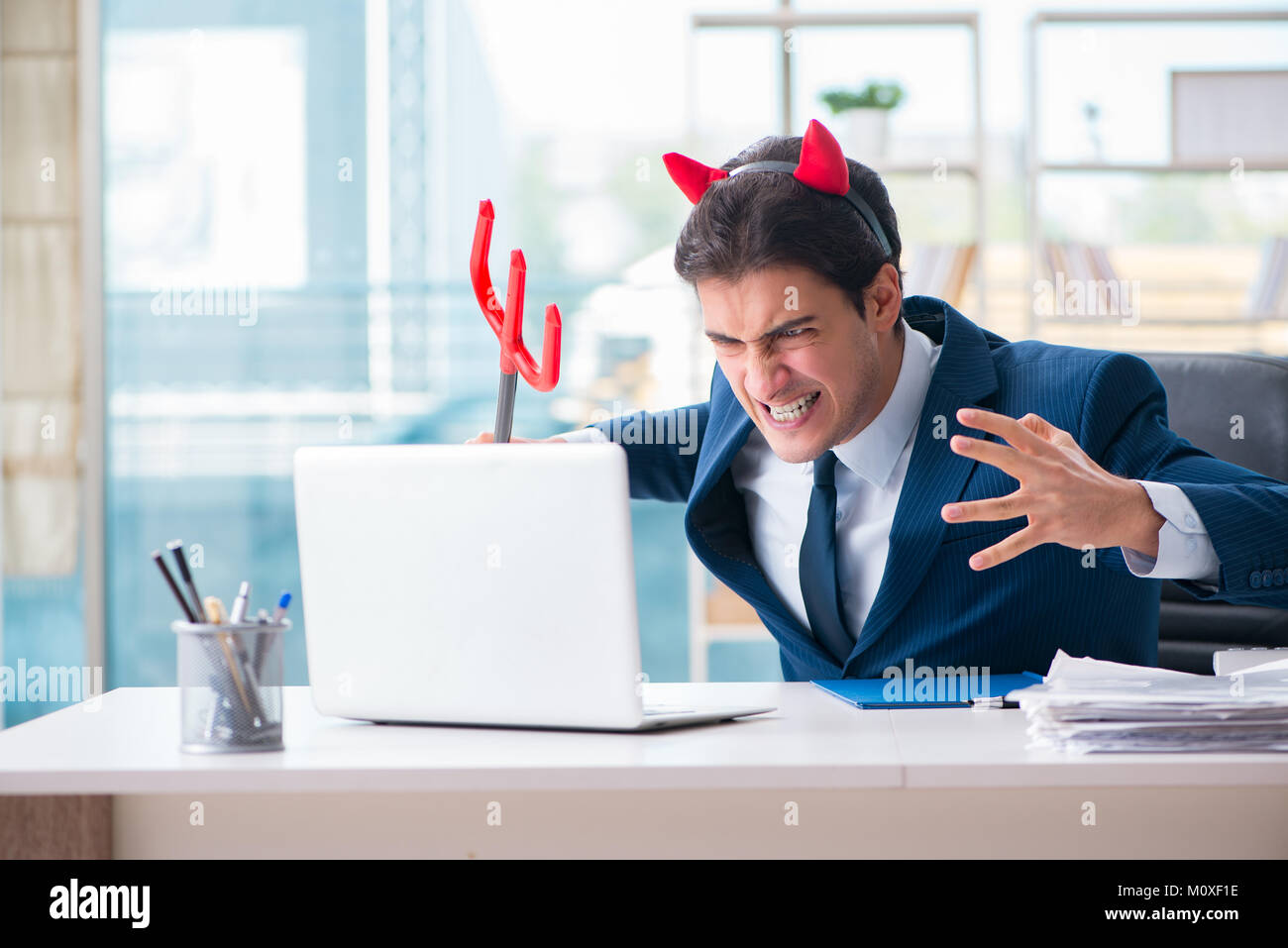 Devil angry businessman in the office Stock Photo - Alamy