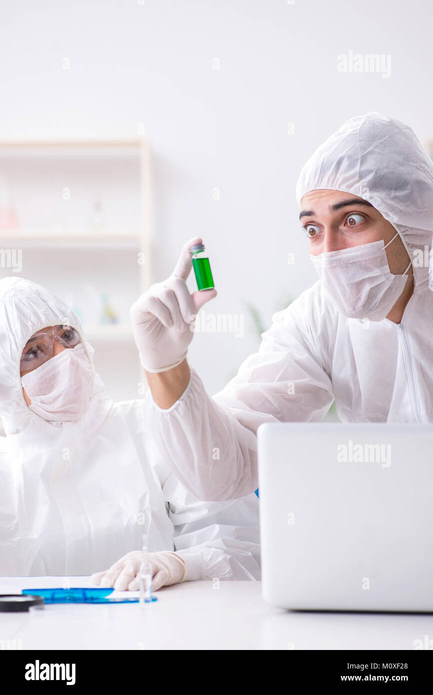 Two chemists working in the lab Stock Photo - Alamy