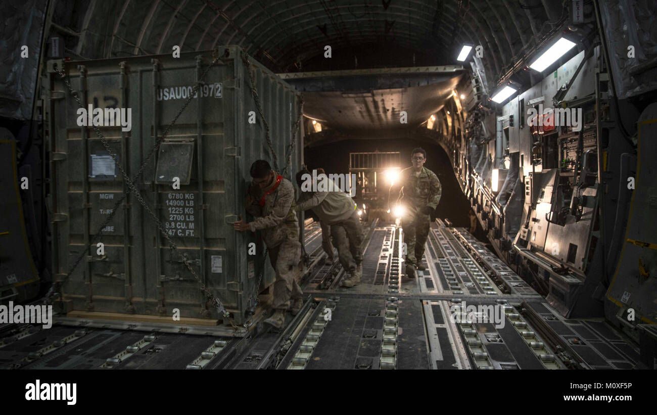LOCATION, Iraq – A U.S. Marine corporal and Air Force load masters a ...