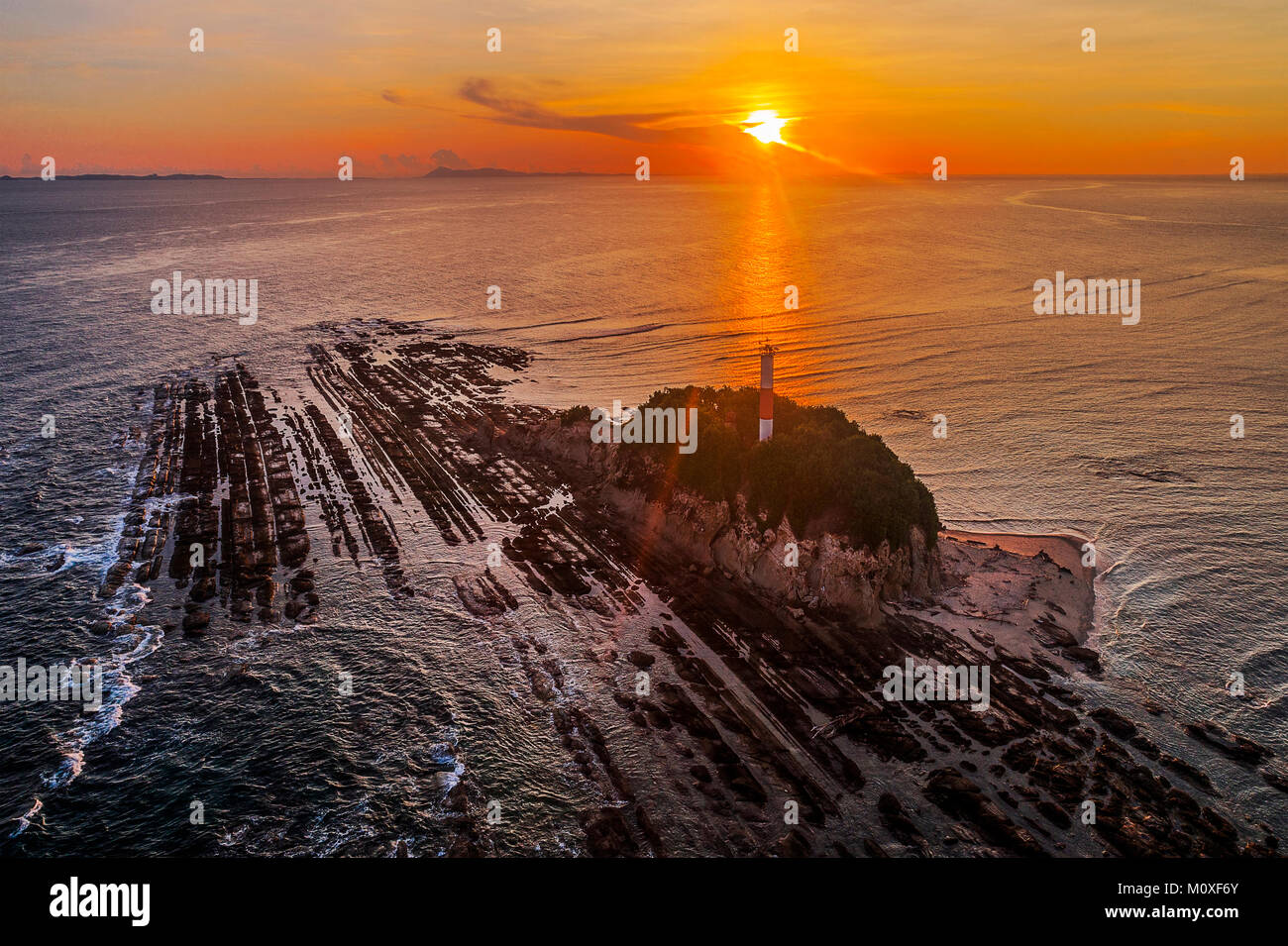 Lighthouse aerial view in the middle of sea at sunrise, Kudat, Malaysia ...