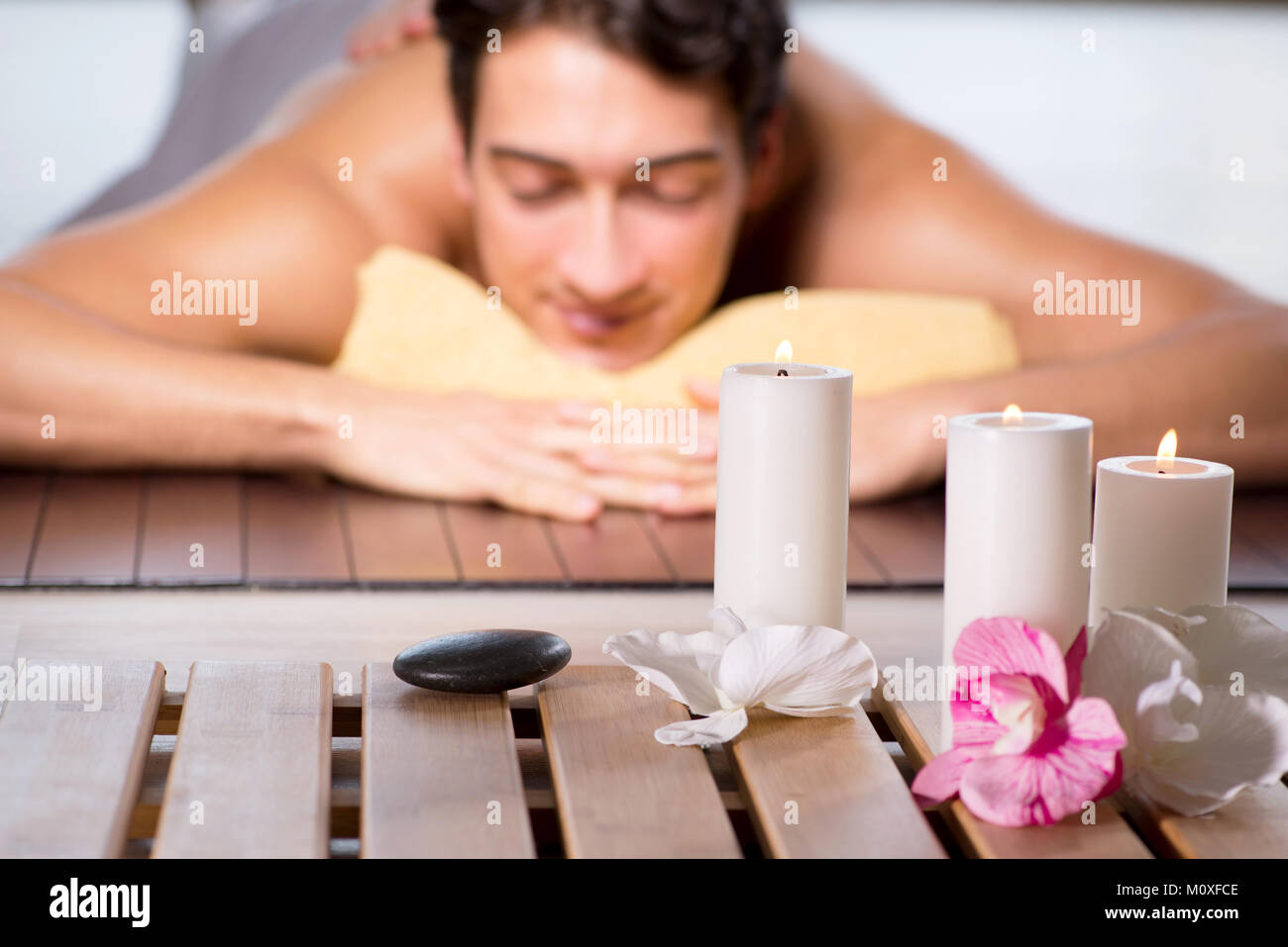 Young handsome man during spa procedure Stock Photo - Alamy