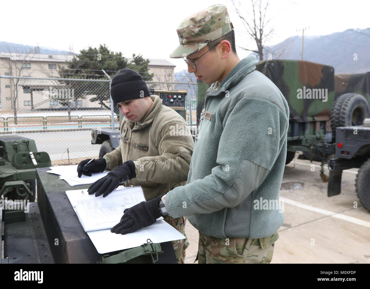 Two Soldiers assigned to Headquarters and Headquarters Battery, 210th ...