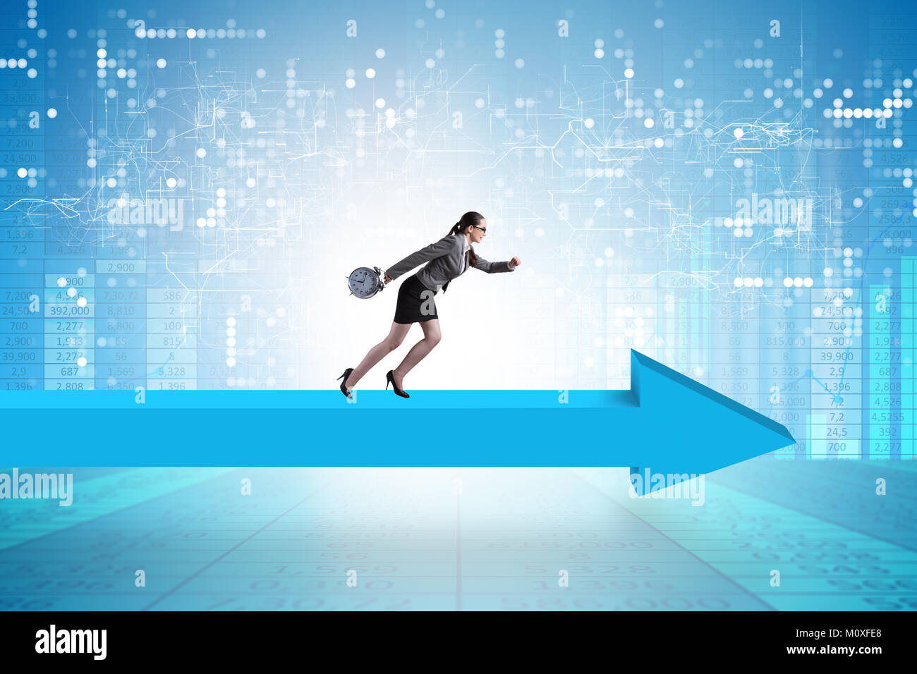 Businesswoman walking on arrow sign Stock Photo - Alamy