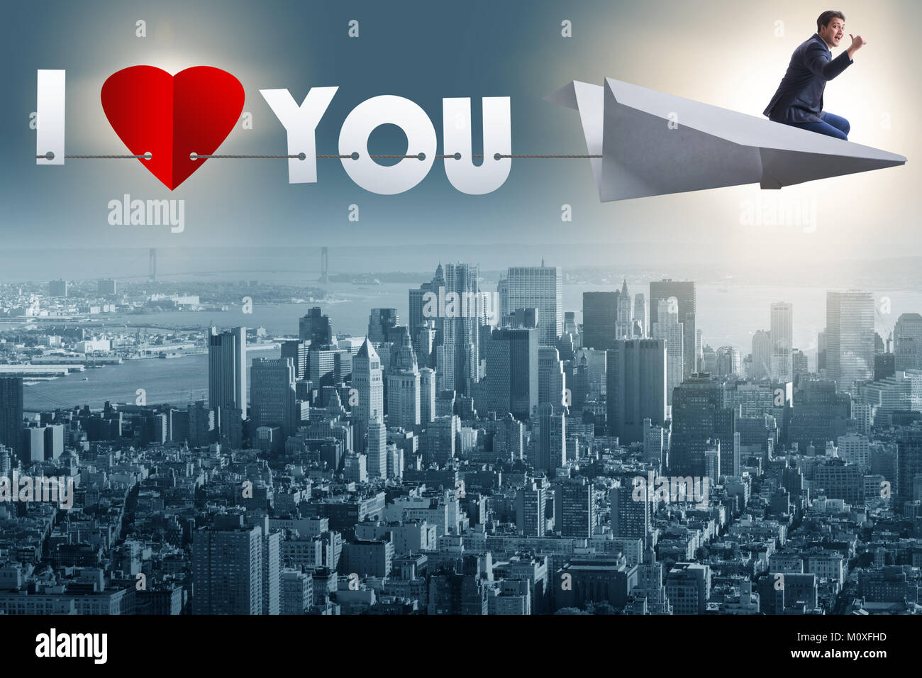 Romantic concept with man on paper plane I Love you Stock Photo - Alamy
