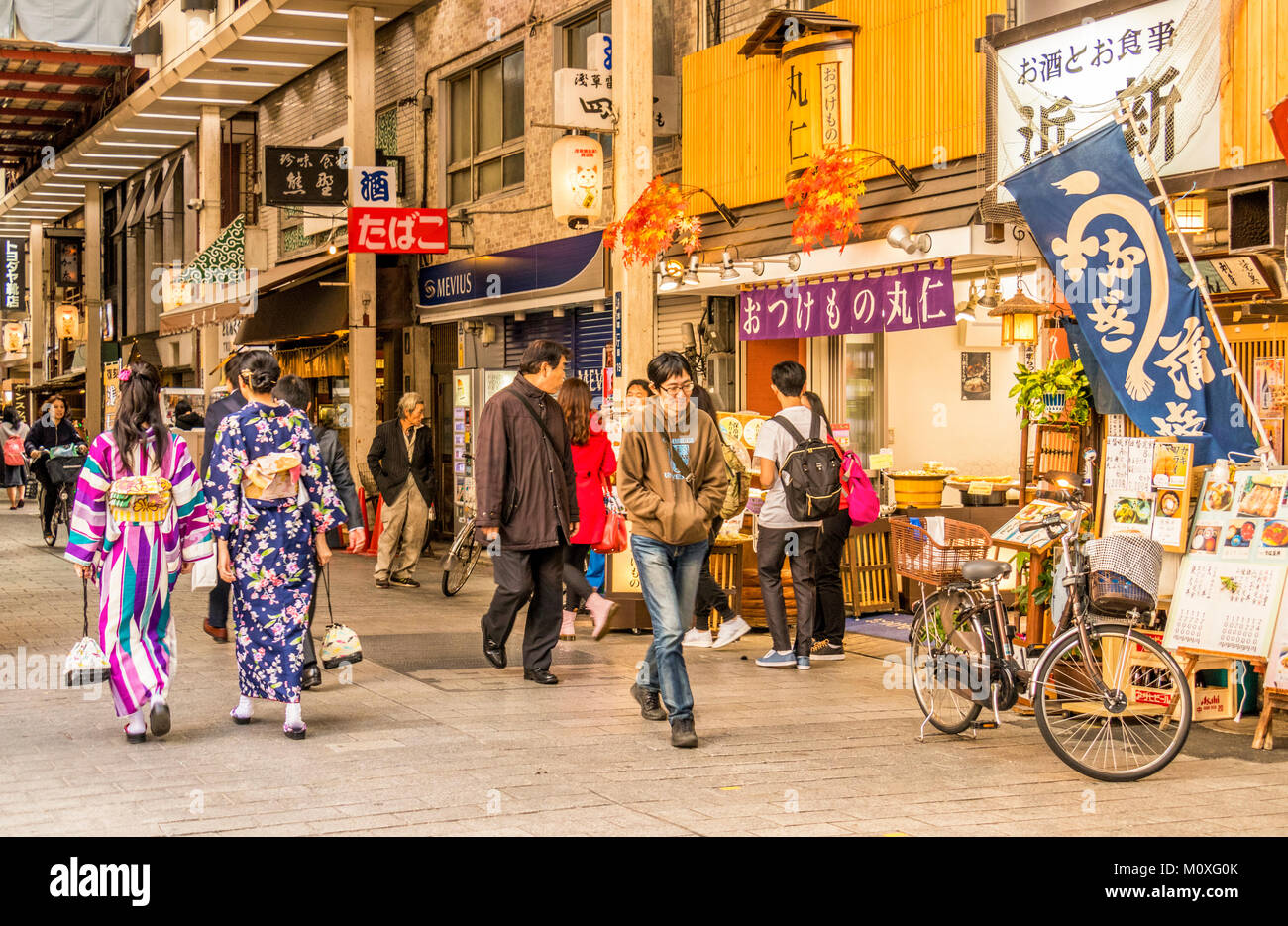 People tourist and visitors enjoying shopping exploring and walking ...