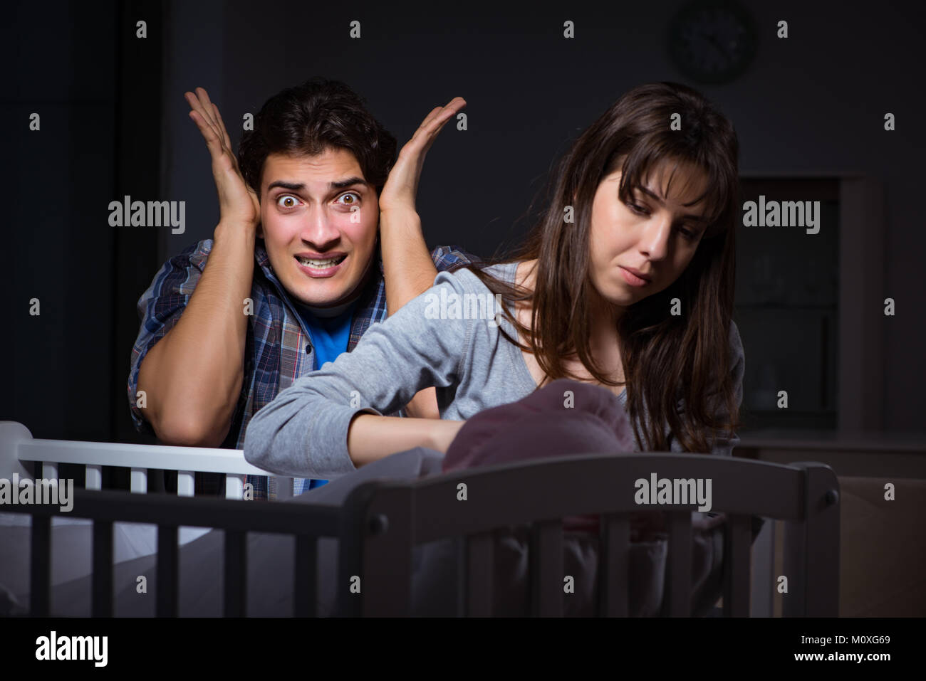Young parents sleepless with newborn baby at night Stock Photo - Alamy