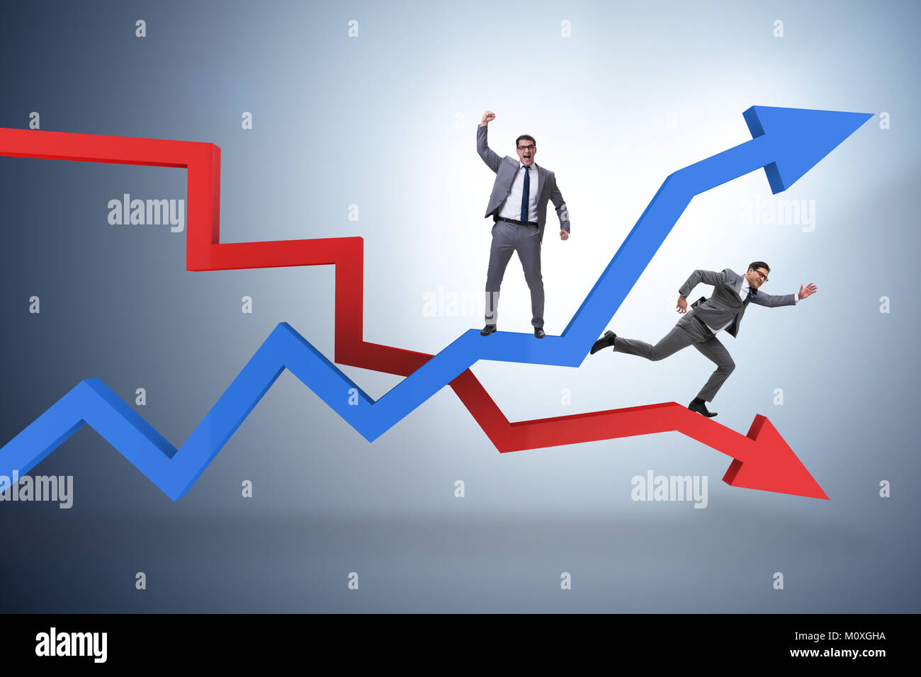 Businessman with charts of growth and decline Stock Photo - Alamy