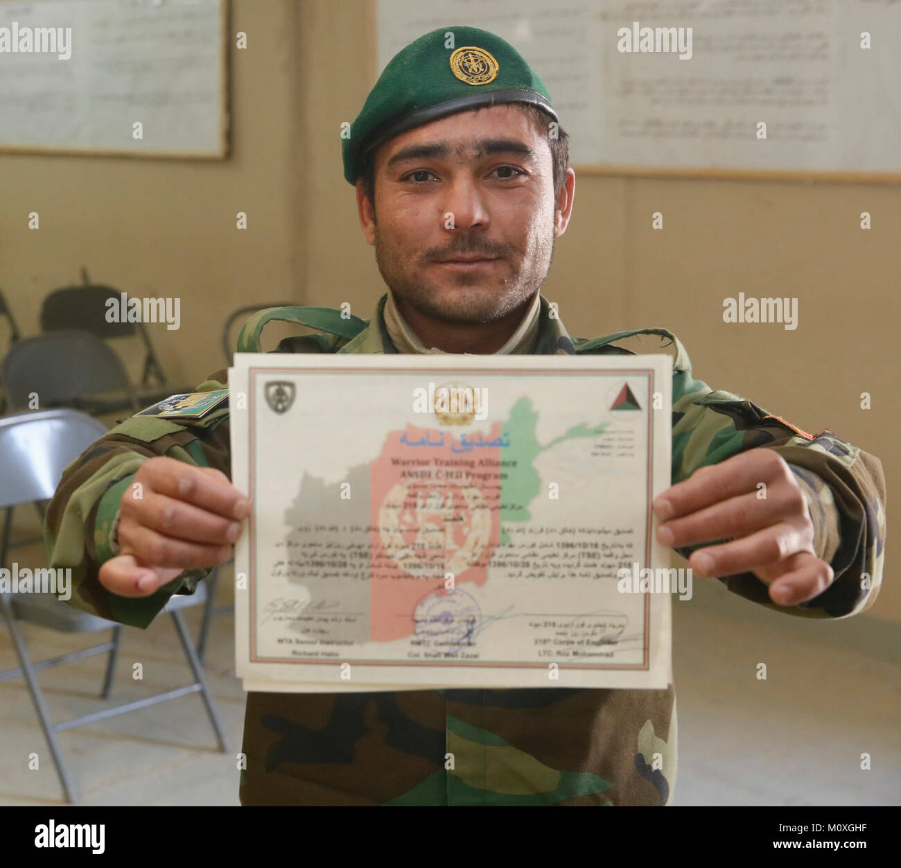 A solider with the Afghan National Army 215th Corps displays his ...