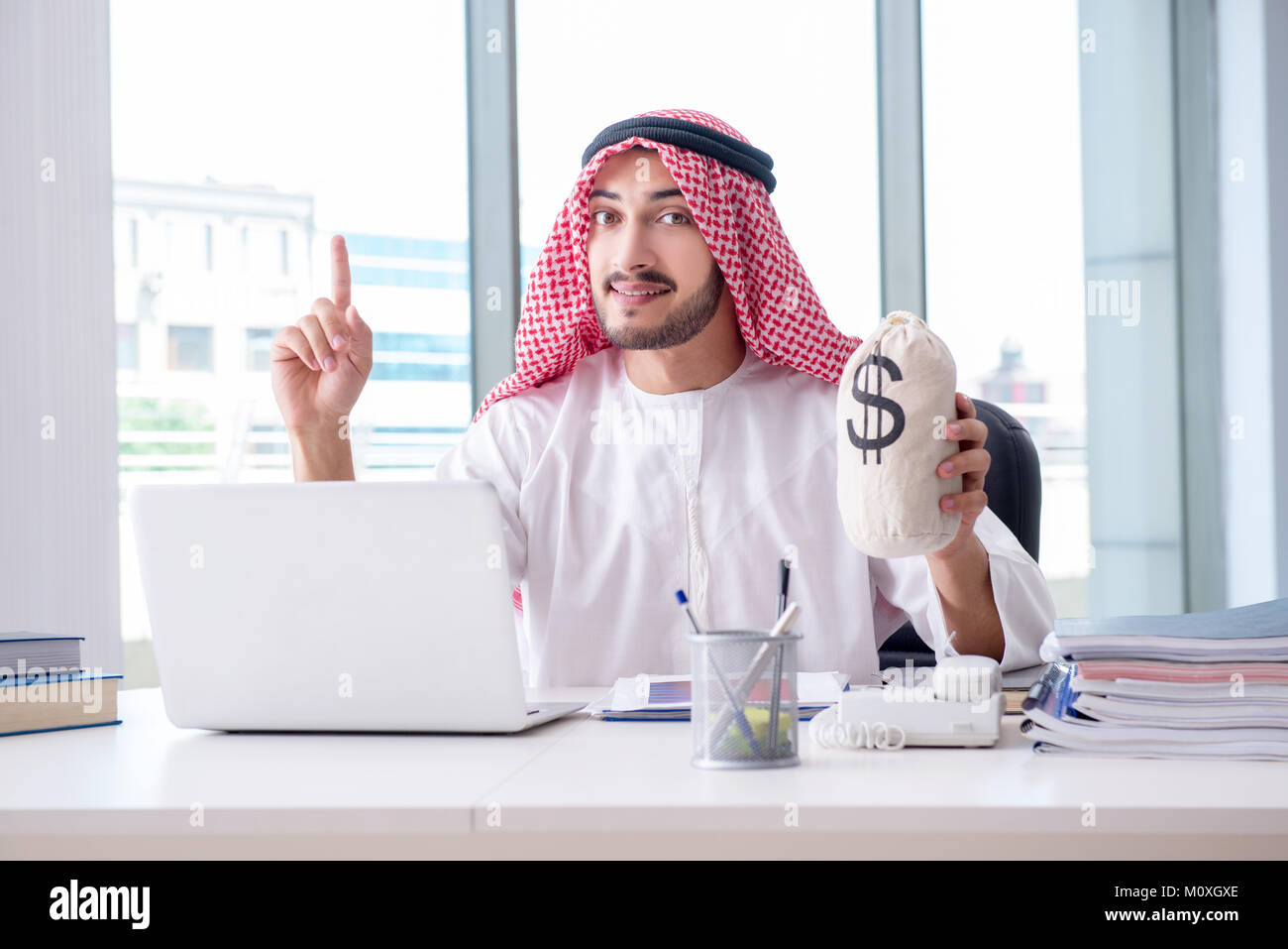 Arab businessman working in the office Stock Photo - Alamy