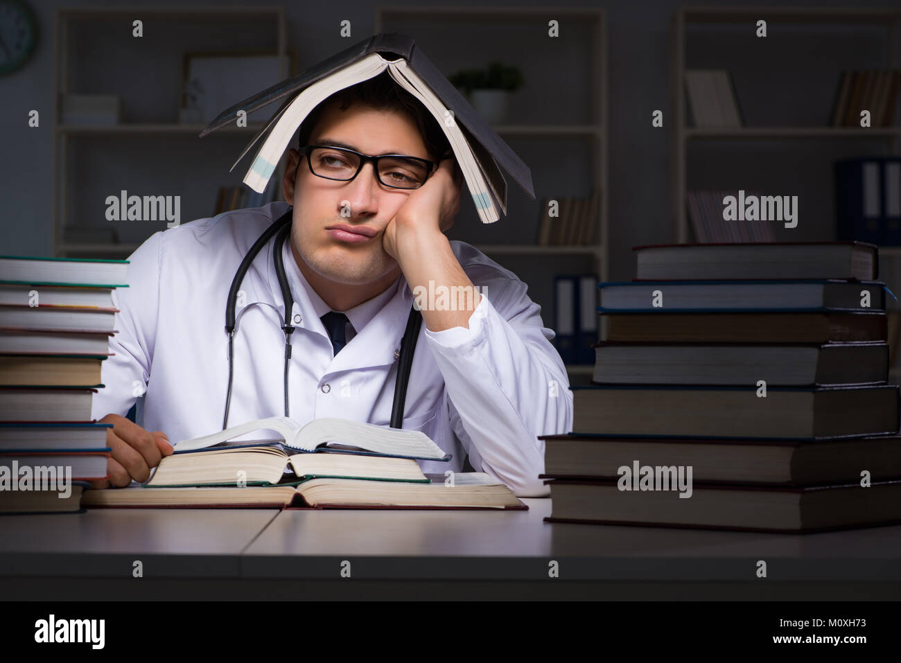 Medical student preparing for university exams at night Stock Photo - Alamy
