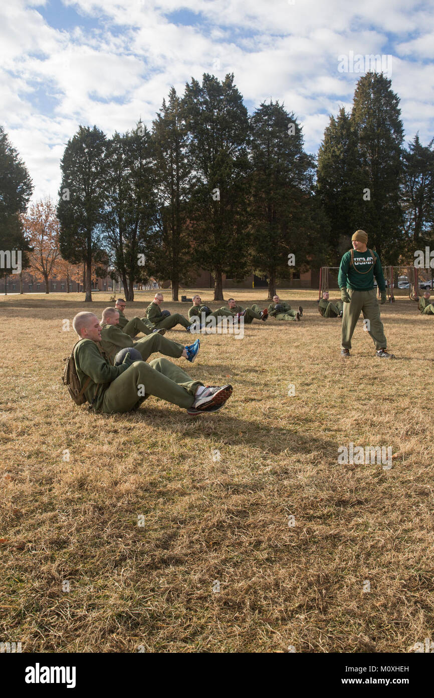 U.S. Marine Corps officer candidates perform crunches during a muscular ...