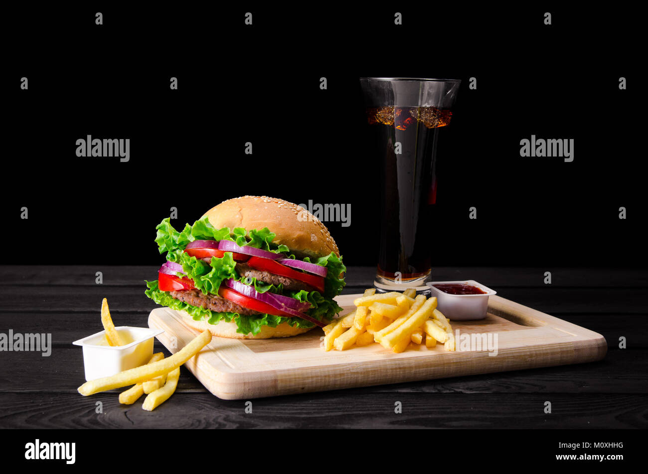Burger served in bun in nutrition fast food concept Stock Photo - Alamy