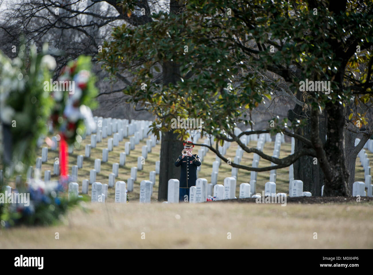 A bugler from The U.S. Army Band, “Pershing’s Own”, plays taps during ...