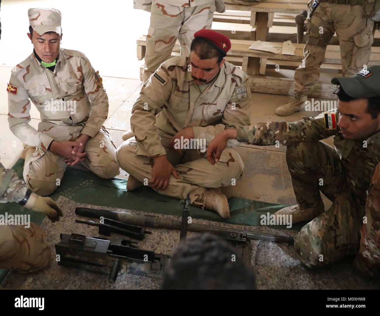 Iraqi army soldiers from the 38th Brigade, learn how to disassemble a ...