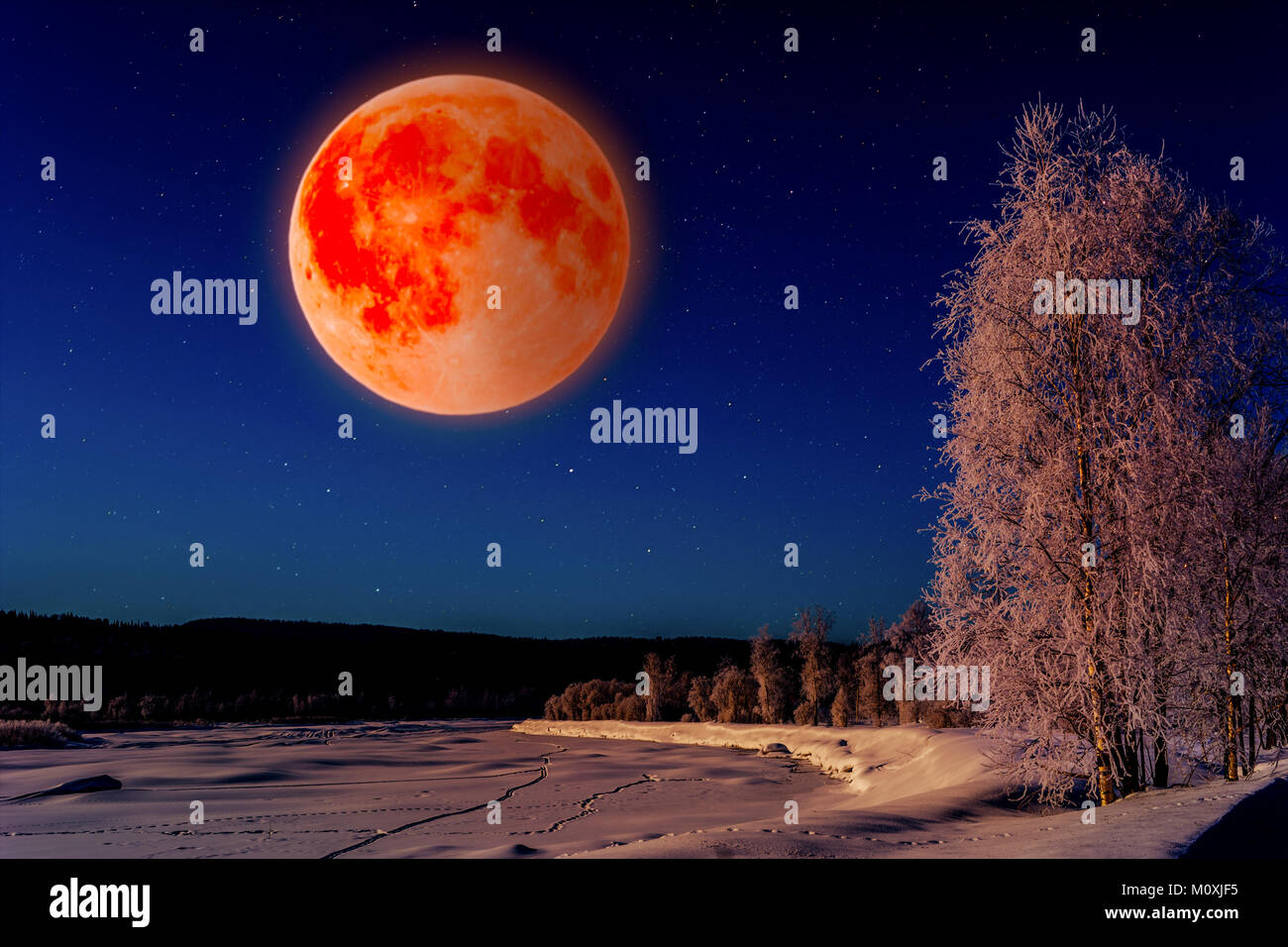 Super bloody moon and winter landscape view Stock Photo - Alamy