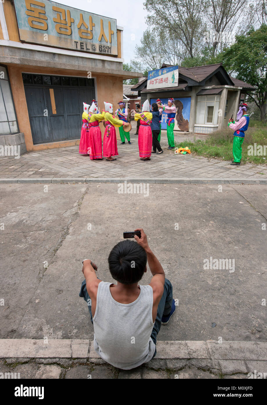 North Korean man sitting down on film set at Pyongyang film studio ...