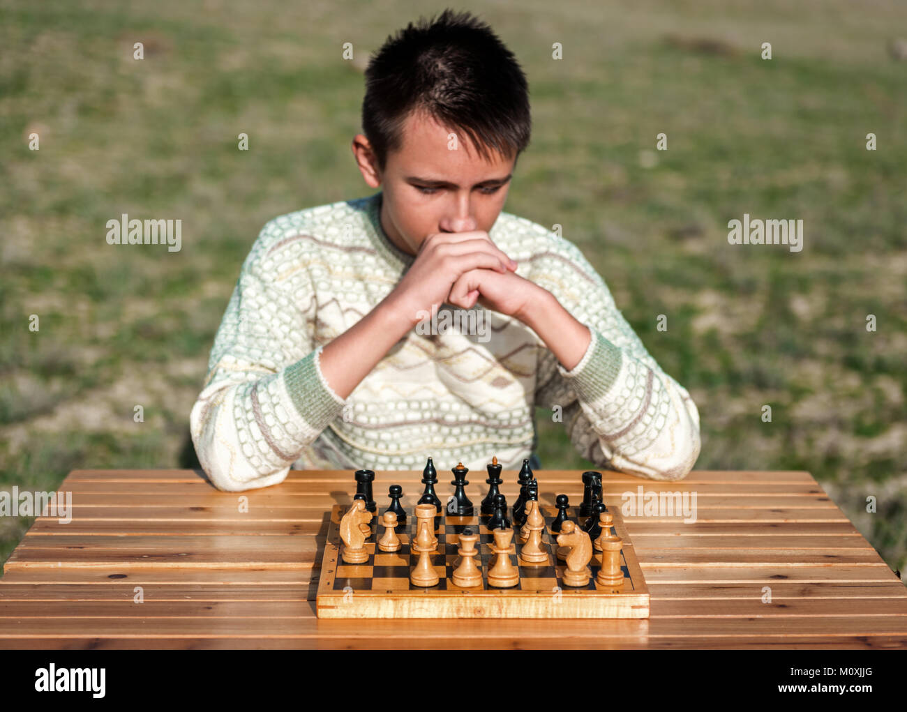 Teenager playing chess Stock Photo - Alamy