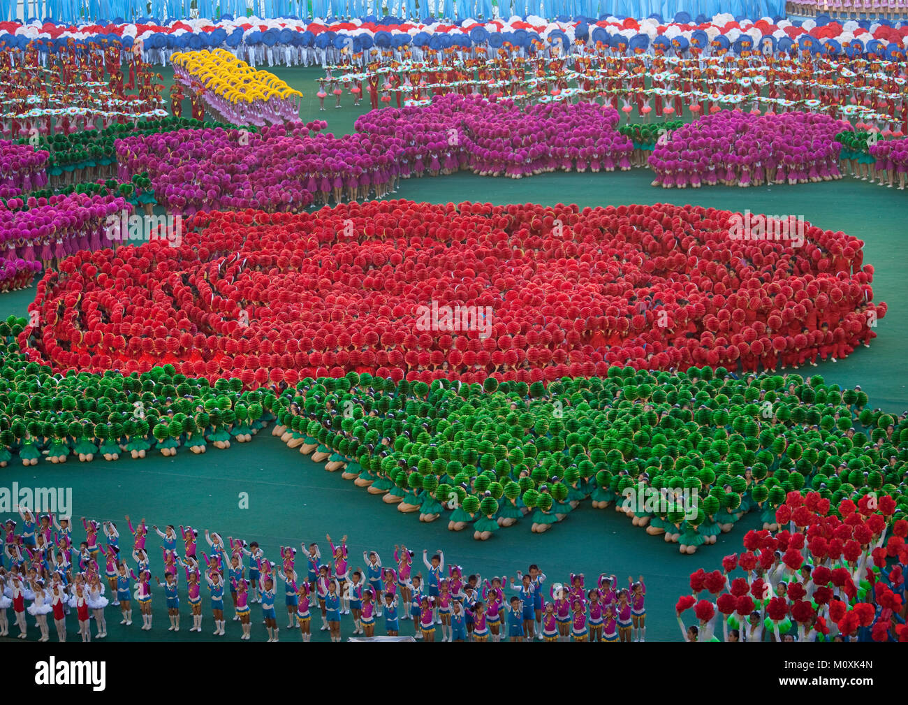 North Korean performers making a giant Kimilsungia flower during the ...