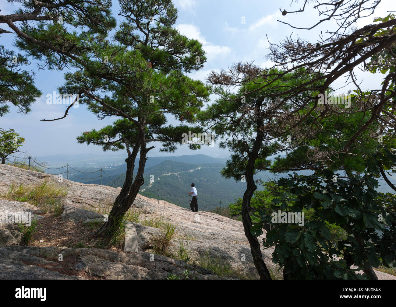 North Korean man walking in Moran park, Pyongan Province, Pyongyang ...