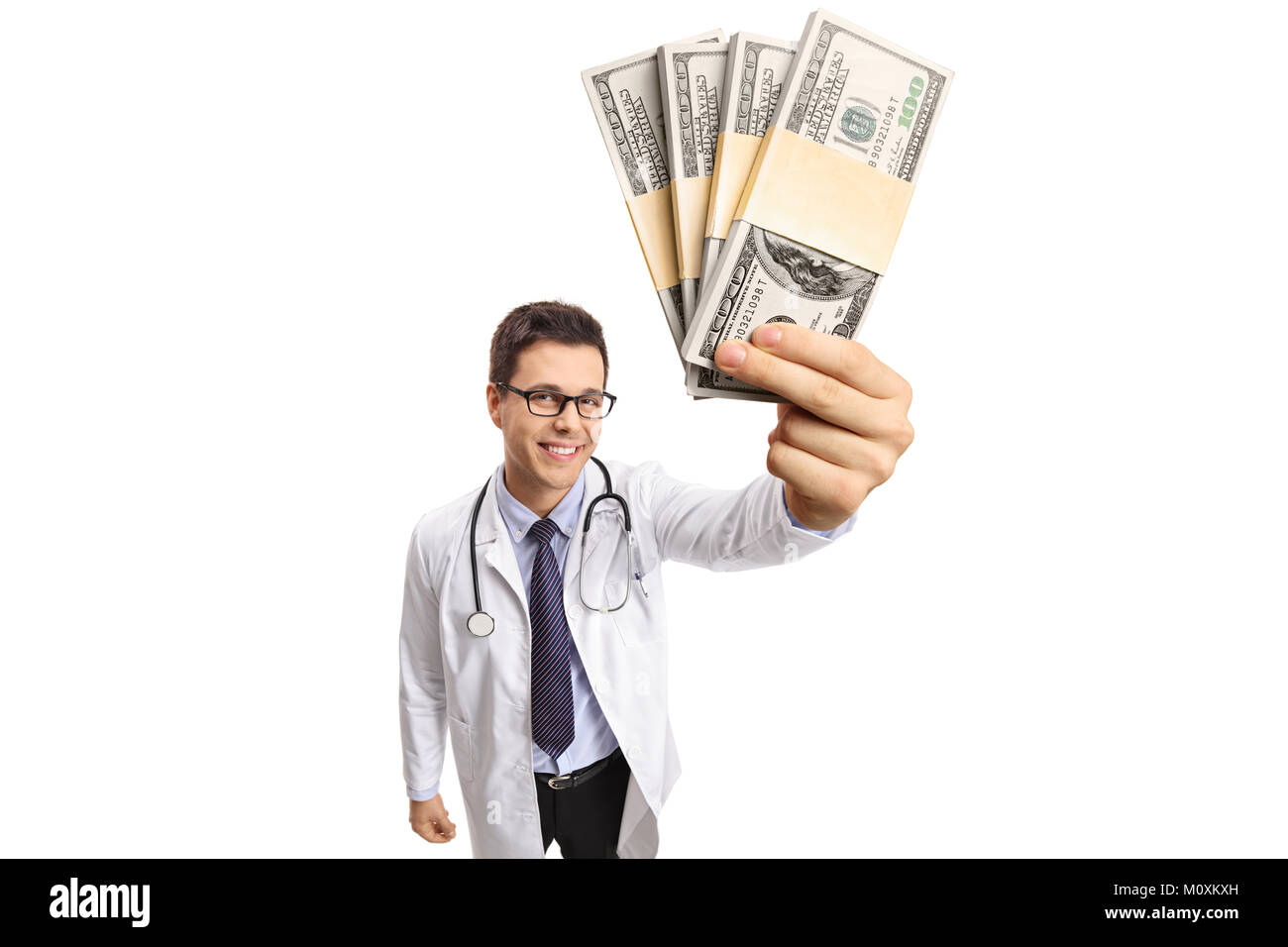 Doctor showing bundles of money isolated on white background Stock ...