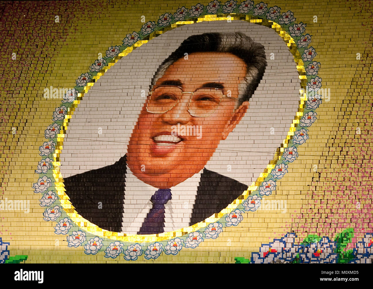 Kim il Sung portrait made by children pixels holding up colored boards ...