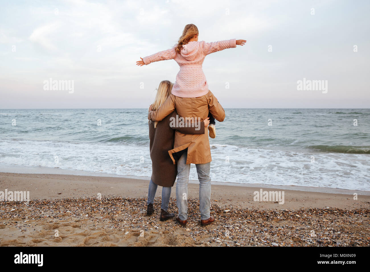 Back view three women hugging hi-res stock photography and images - Alamy