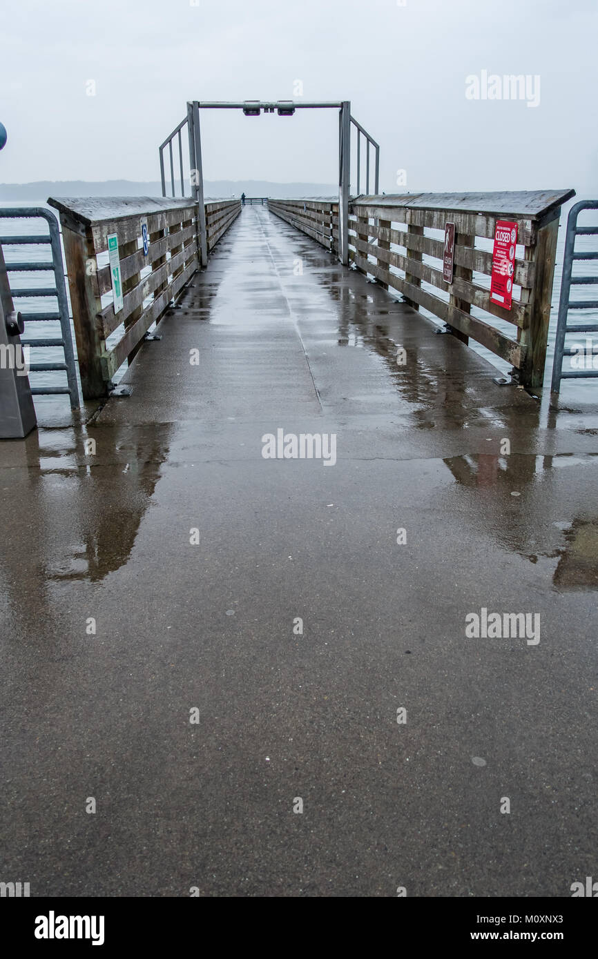 A view of the pier at Dash Point, Washington on a rainy day Stock Photo ...