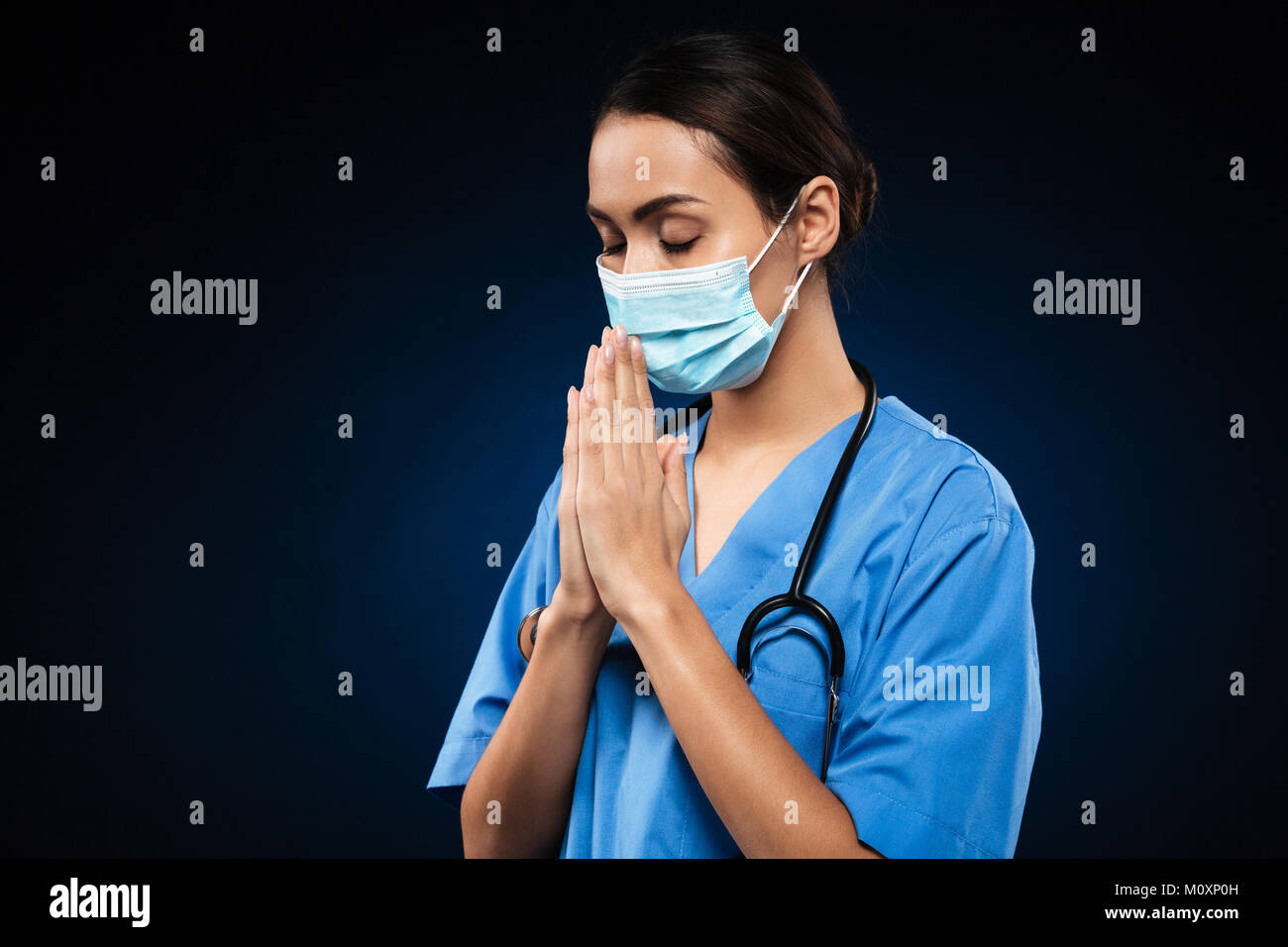 Doctor pray hi-res stock photography and images - Alamy