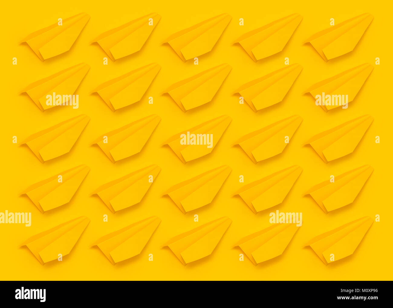 Pattern of yellow origami planes on a yellow background Stock Photo - Alamy