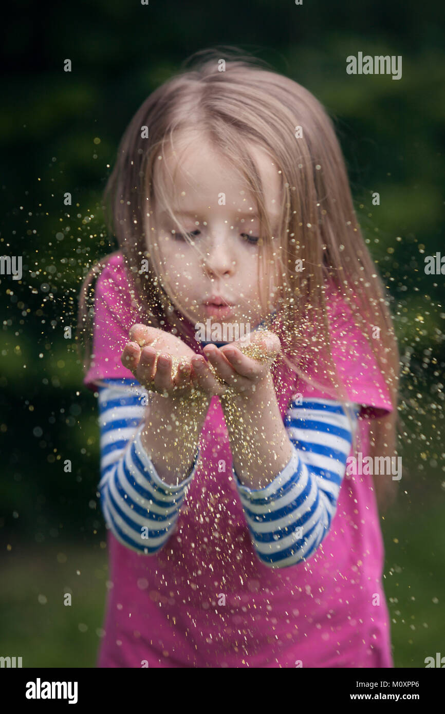Blowing glitter child hi-res stock photography and images - Alamy