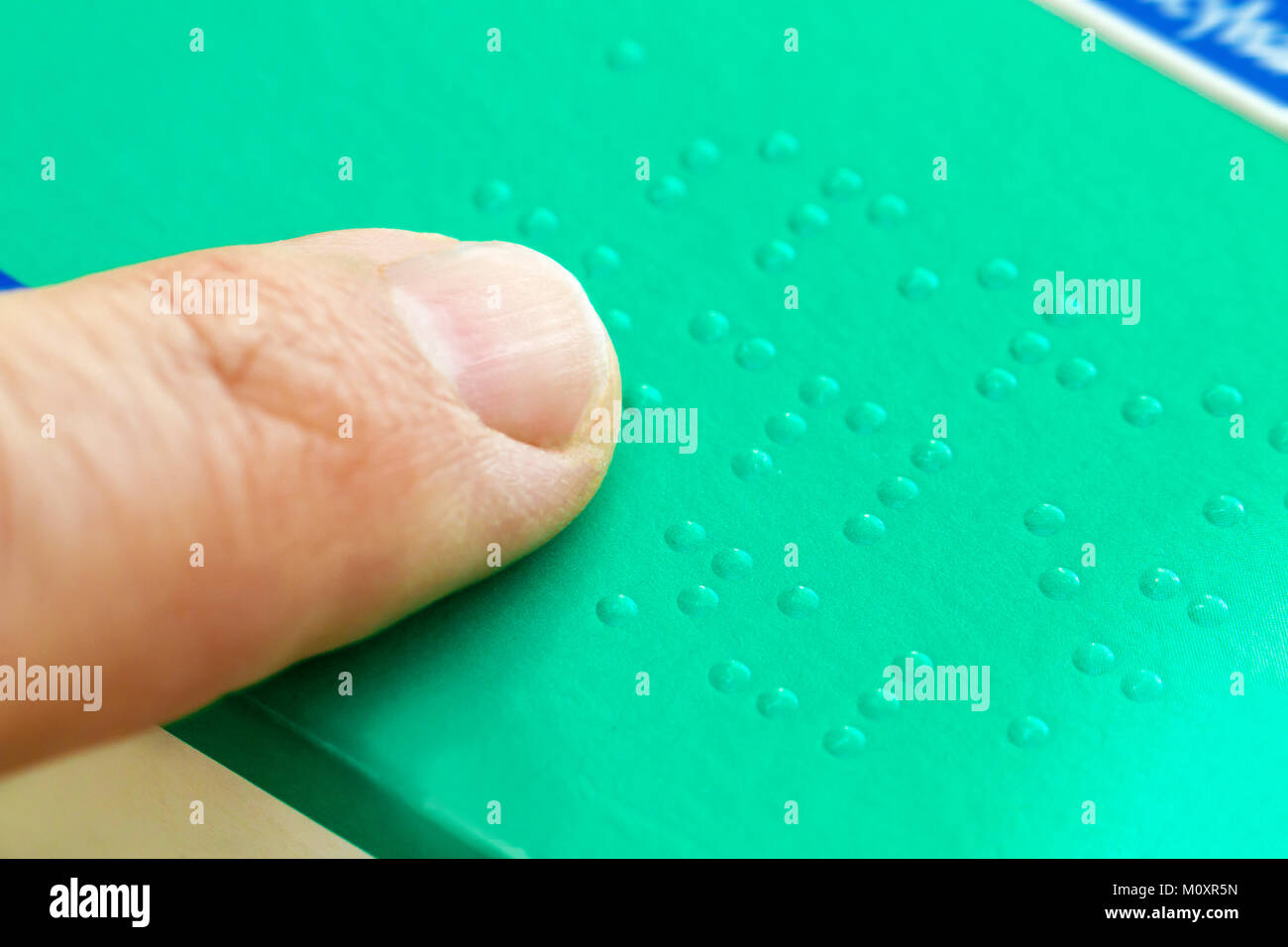Man reading braille Stock Photo - Alamy