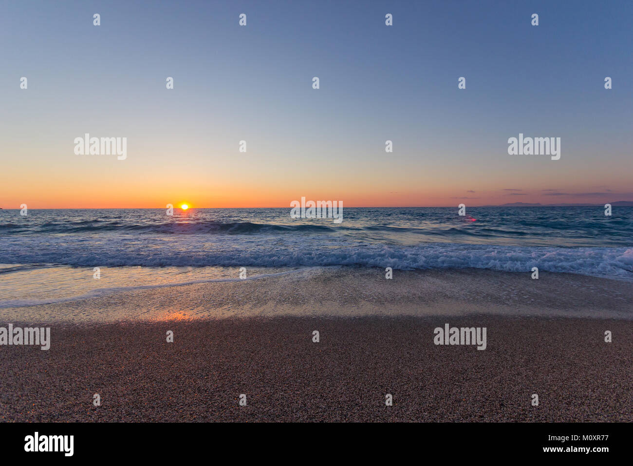 beautiful beach with sunset in the island of Zante in Greece Stock ...