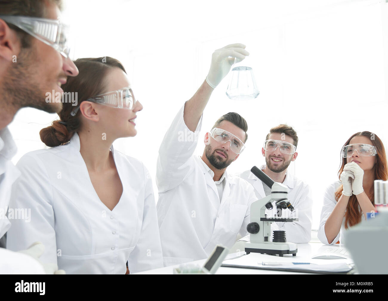 group of young workers are working in biochemistry lab Stock Photo - Alamy