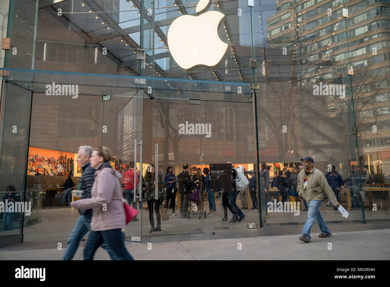 The Apple shines over the Upper West Side neighborhood Apple store in ...