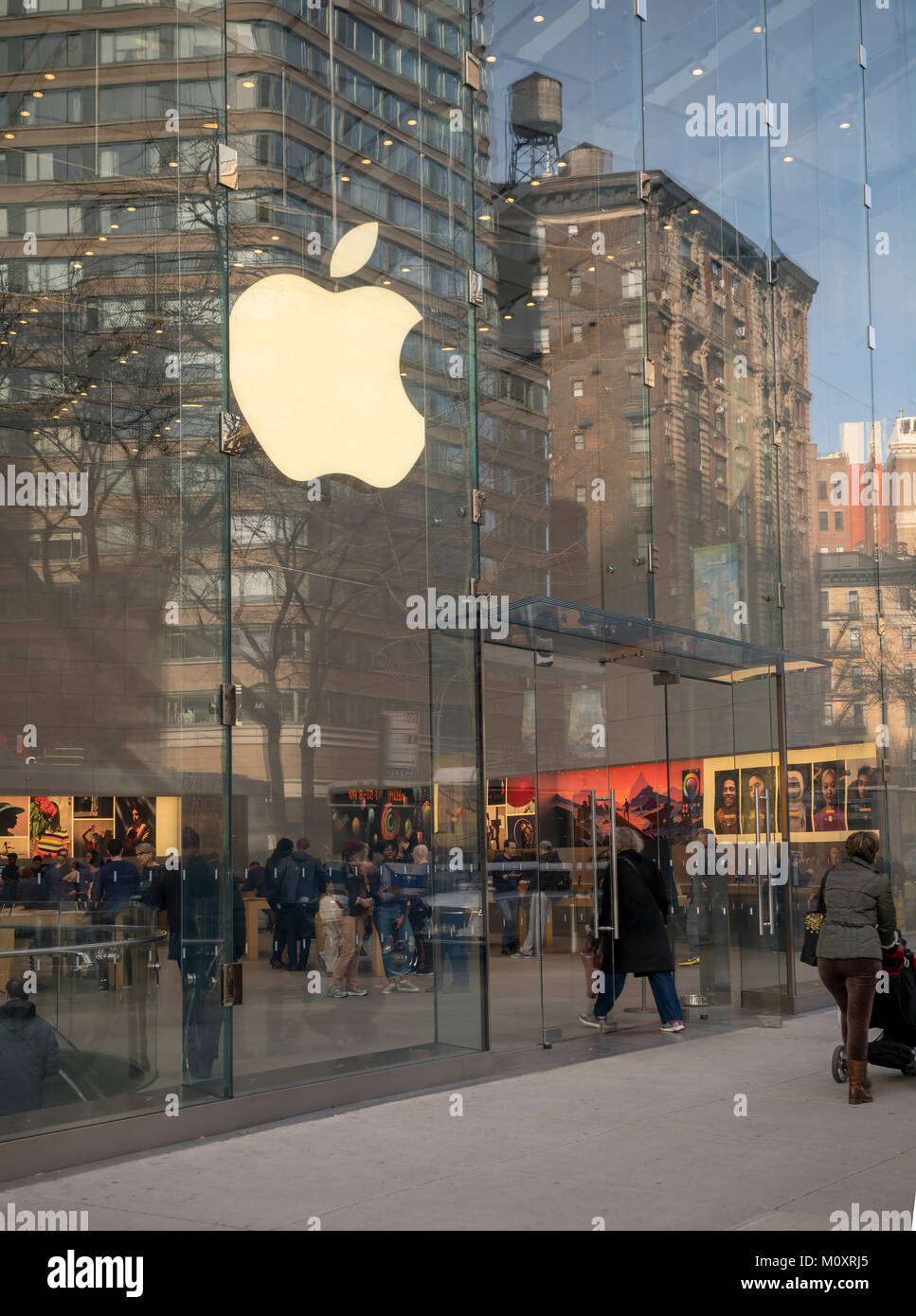 The Apple shines over the Upper West Side neighborhood Apple store in ...