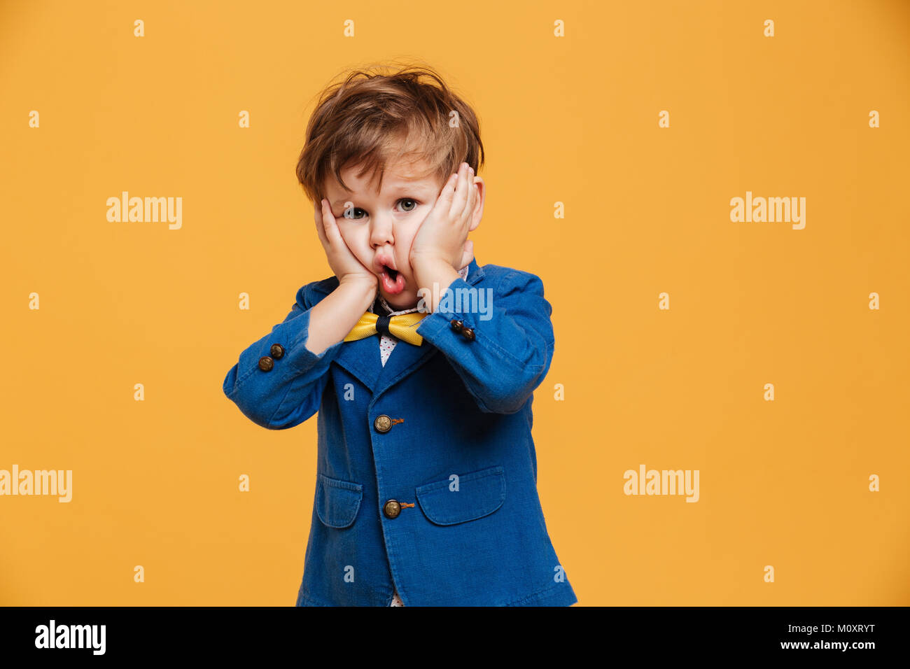 Image of shocked screaming boy child standing isolated over yellow ...