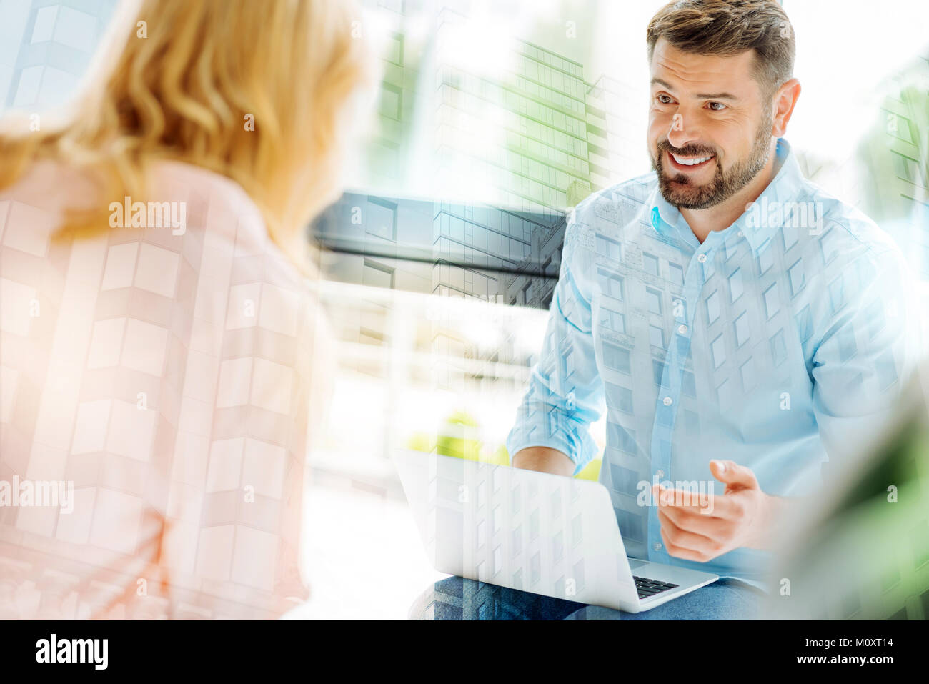 Enthusiastic colleagues having exciting discussion Stock Photo - Alamy