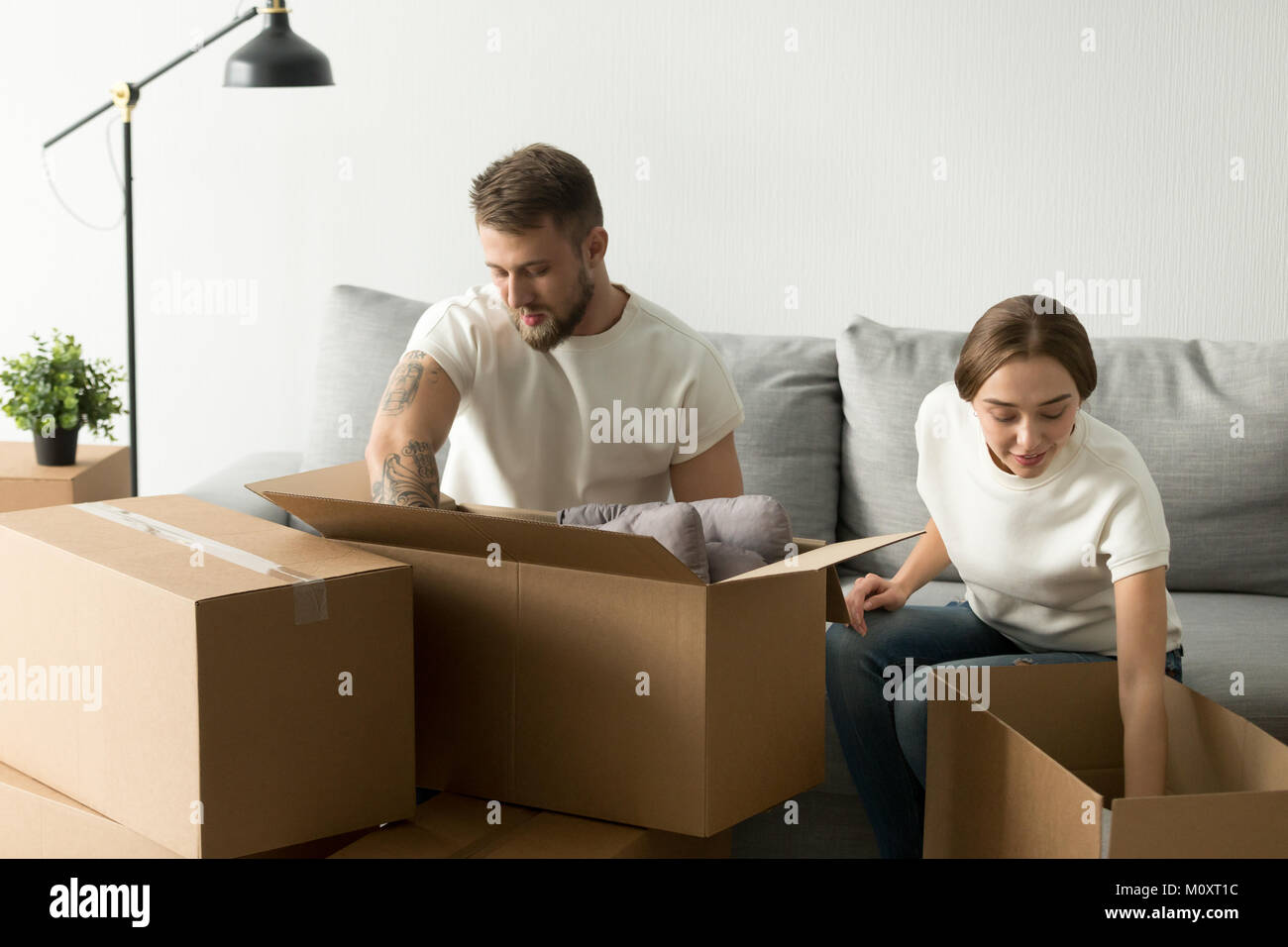 Unpacking boxes hi-res stock photography and images - Alamy