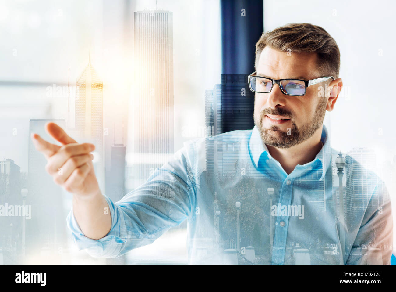 Confident director pointing with right hand Stock Photo - Alamy