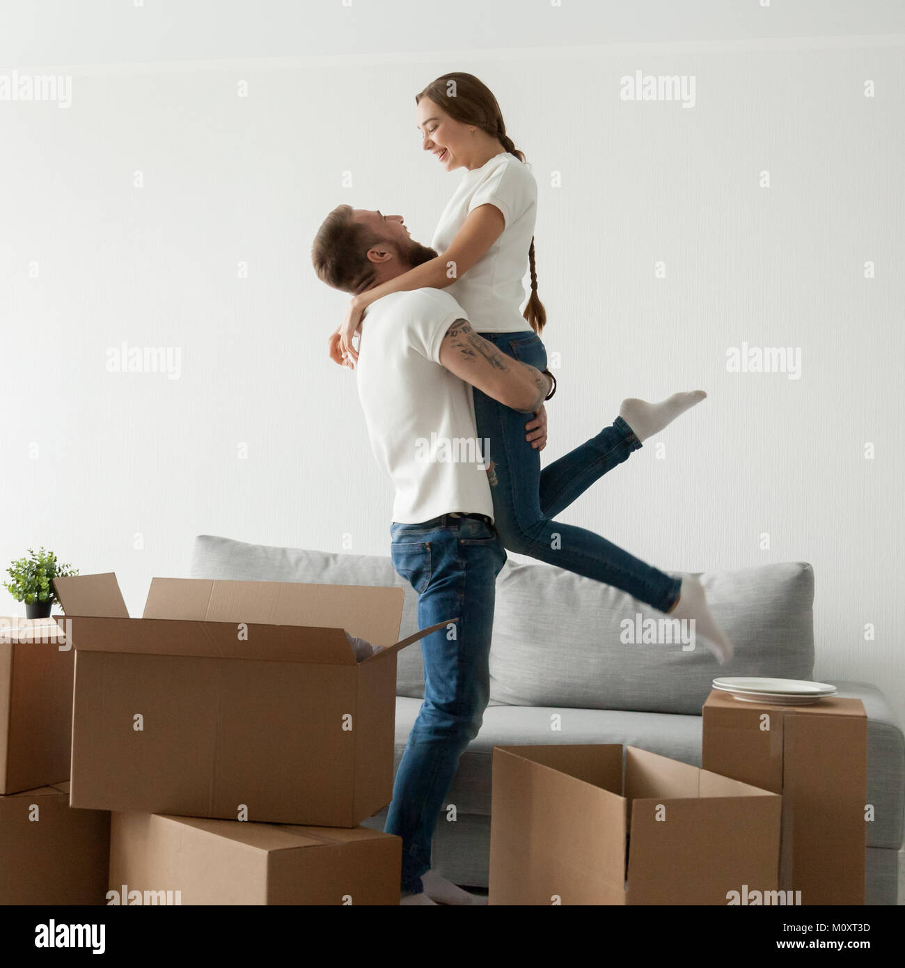 Man woman standing boxes hi-res stock photography and images - Alamy